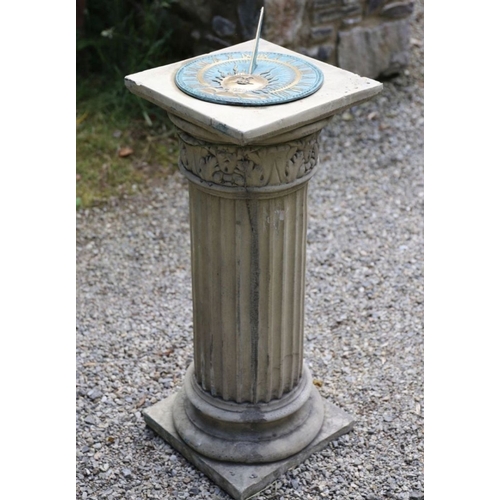 A BRONZE SUNDIAL ON STONE CORINTHIAN COLUMN PEDESTAL BASE.