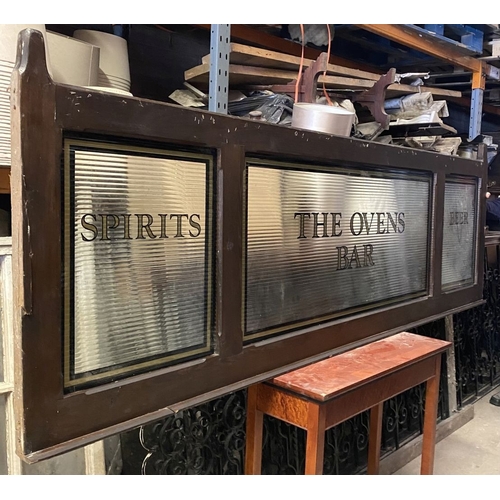 A LARGE HEAVY HARDWOOD FRAMED BAR SIGN, with three panels of double ...