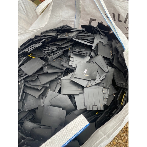 Very large builders bag full of thousands of plastic scrapers