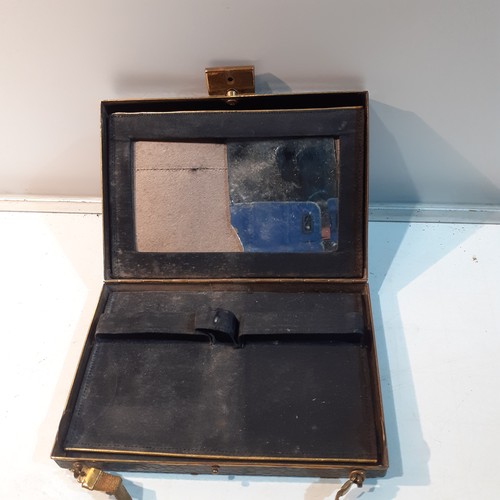 Small vintage metal case. Inside consists of two gold coloured compact ...