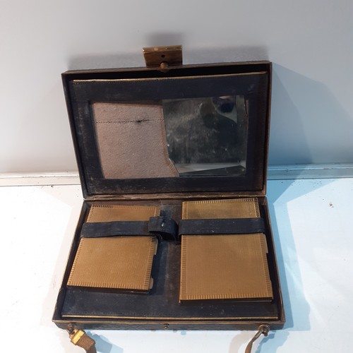 Small vintage metal case. Inside consists of two gold coloured compact ...