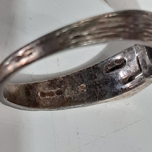 Sterling silver ring with initials JS.