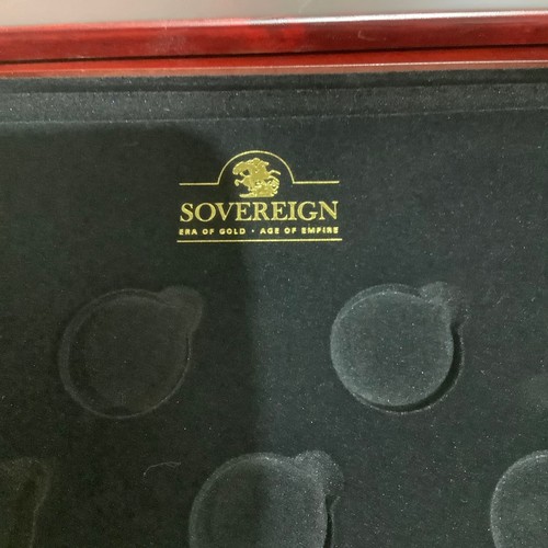 Dark wood display draw by Sovereign for coins