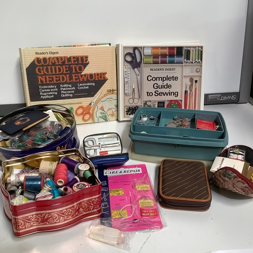Selection of sewing bits in tins plus two books