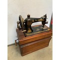 Singer sewing machine in wooden case with key