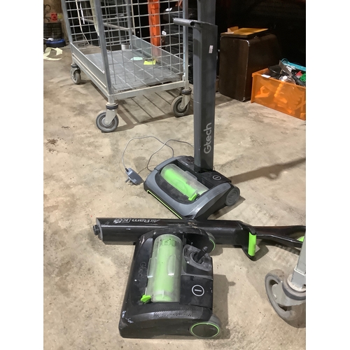 Pair of cordless Gtech vacuum cleaners - one with charger