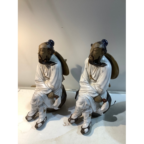 Pair of ceramic mud men