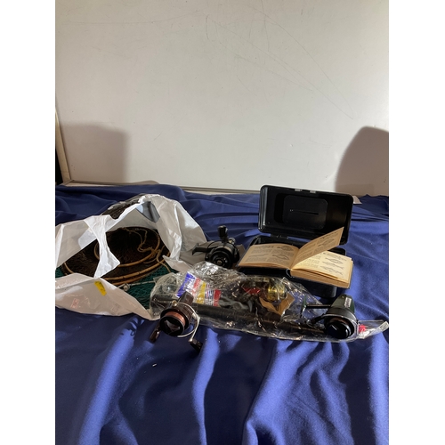 Selection of fishing equipment to include nets, fishing reels Daiwa ...