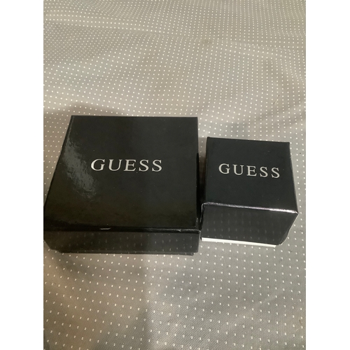 Pair of designer guess rings