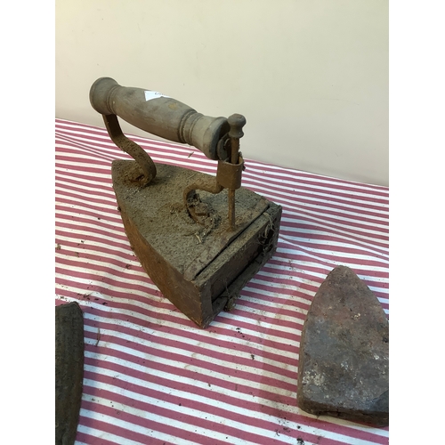Collection of cast iron flat irons plus Victorian slug iron