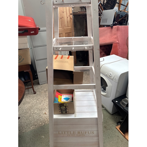 Floorstanding wooden retail display stand with internal storage cupboard