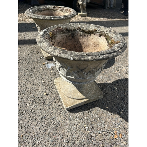 Pair of reconstituted stone concrete garden planters on plinths