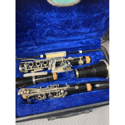 Lark cased clarinet in good condition with two learning books