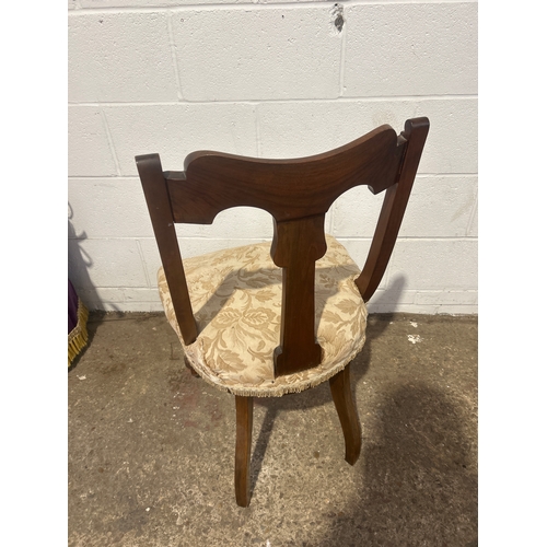 Antique wooden hardwood dark-stained chair with floral cream upholstery