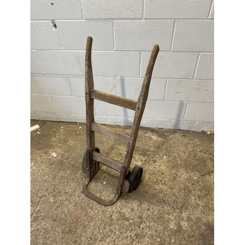 Vintage wooden set of sack barrow with solid wheels
