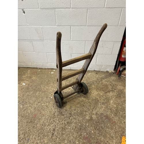 Vintage wooden set of sack barrow with solid wheels