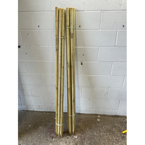 Two bundles of 5 garden stakes - 6ft tall
