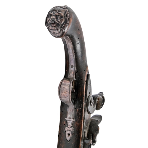 An English 16 bore silver-mounted flintlock pistol, the steel barrel ...