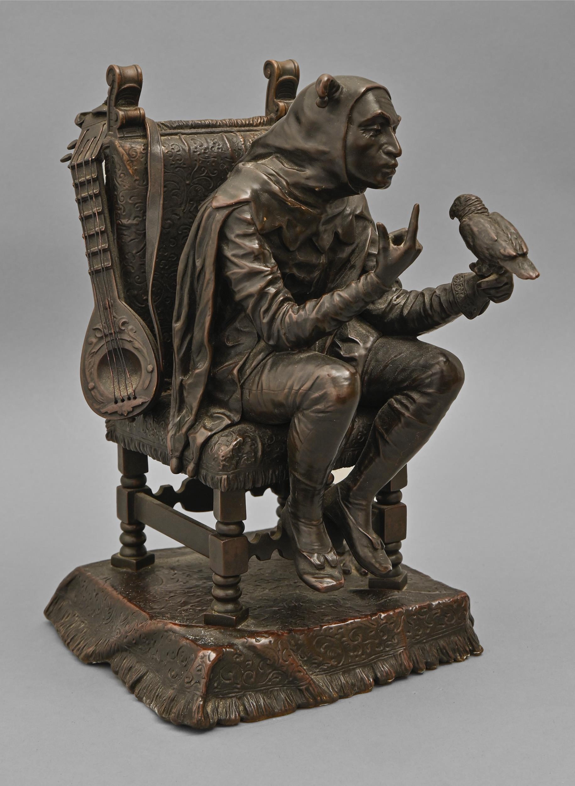 A bronze sculpture of a jester training a bird, cast from a model by F ...