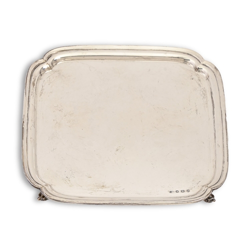A George V silver salver, shaped square, on volute feet, 26 x 26cm, by ...