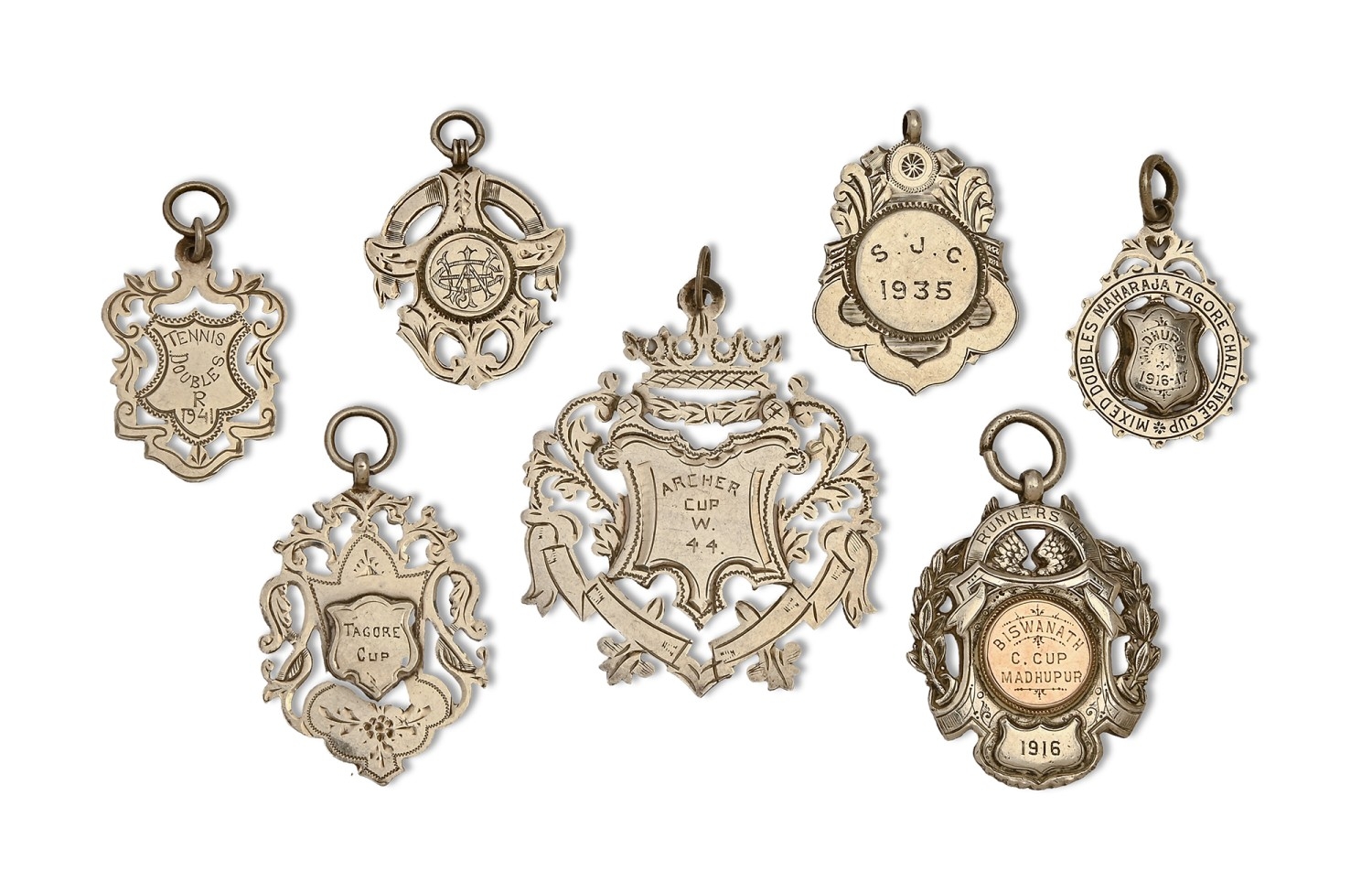 Seven pierced silver watch fob shields, early 20th cm, various sizes ...