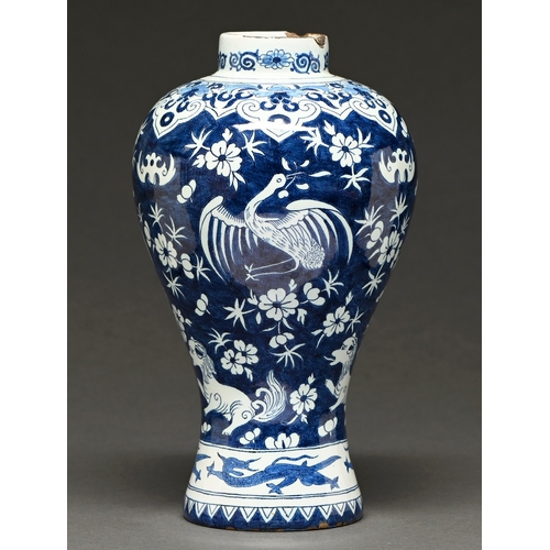 A Dutch Delftware vase, 19th c, painted with bats and phoenix on a blue ...