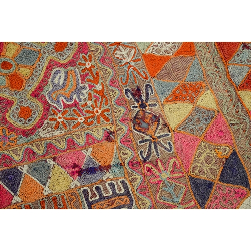 An Iraqi embroidered rug, 153 x 253cm
