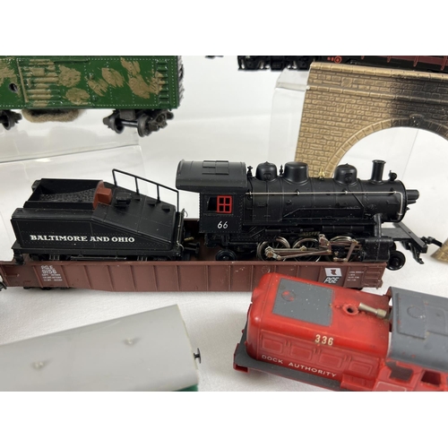 A box of assorted model railway locos, coaches, parts and accessories ...