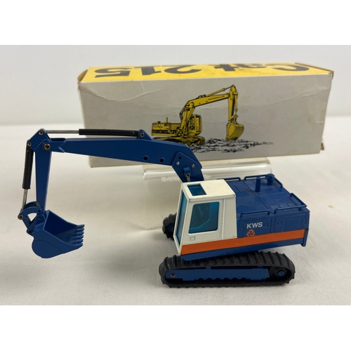 A boxed Caterpillar Cat 215 excavator diecast construction vehicle from ...
