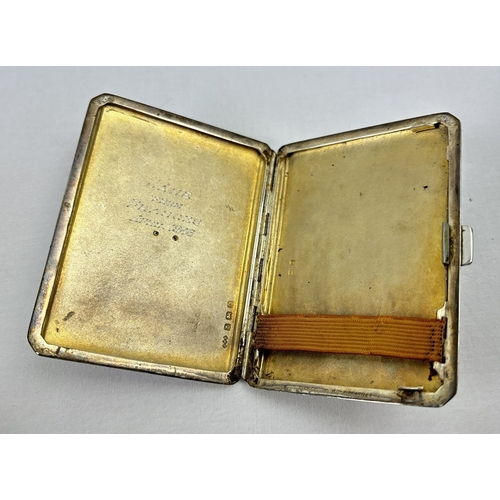 A vintage silver cigarette case with royal blue guilloche panel and ...