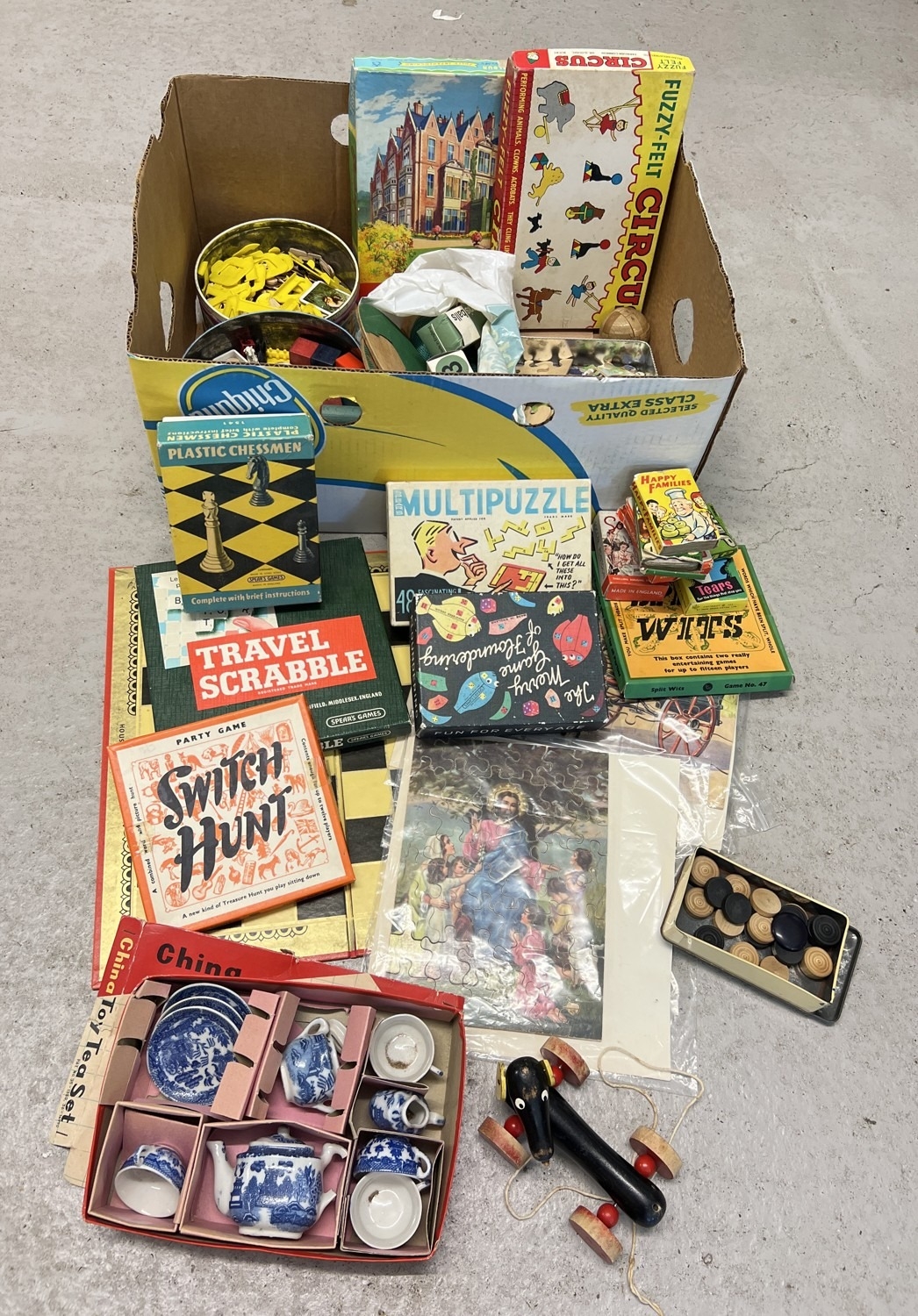 A box of assorted vintage toys, games and puzzles, to include wooden ...