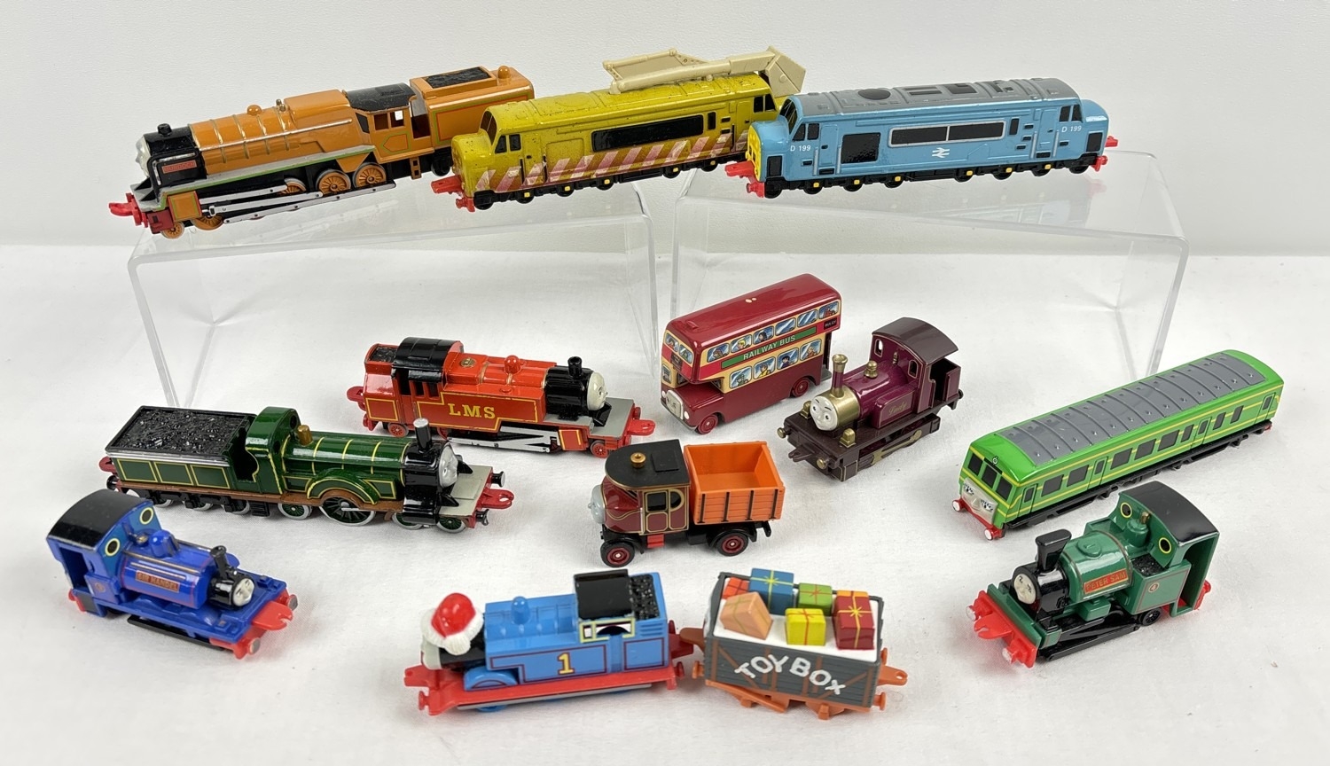 A collection of 13 assorted Ertl diecast Thomas the Tank Engine trains ...