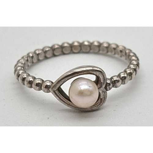 A boxed Pandora birthday cake charm together with a silver bubble ...