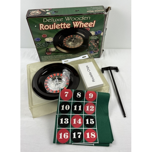 Boxed Jackpot Poker Deluxe wooden Roulette wheel and poker chips.