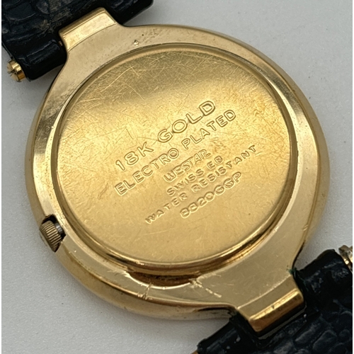 A ladies vintage wristwatch by Westar with black leather strap and 18ct ...