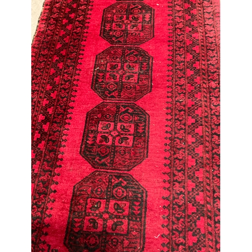 2 VINTAGE RED PATTERNED CARPETS 84” x 39” AND 66” X 36”