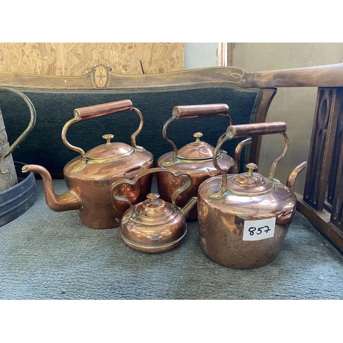 Four copper kettles