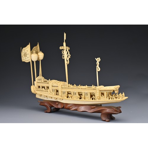 A CHINESE CARVED IVORY MODEL OF A BOAT, 19TH CENTURY. The pleasure boat ...