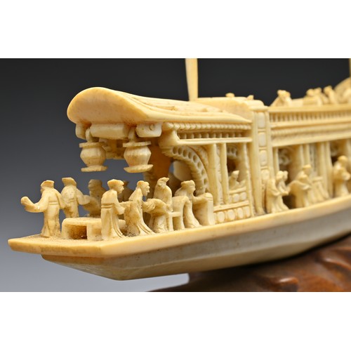 A CHINESE CARVED IVORY MODEL OF A BOAT, 19TH CENTURY. The pleasure boat ...