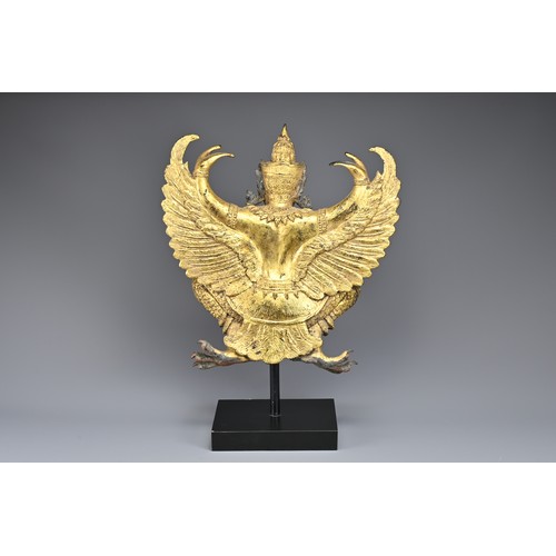 A LARGE THAI GILT BRONZE FIGURE OF GARUDA. The well modelled half man ...