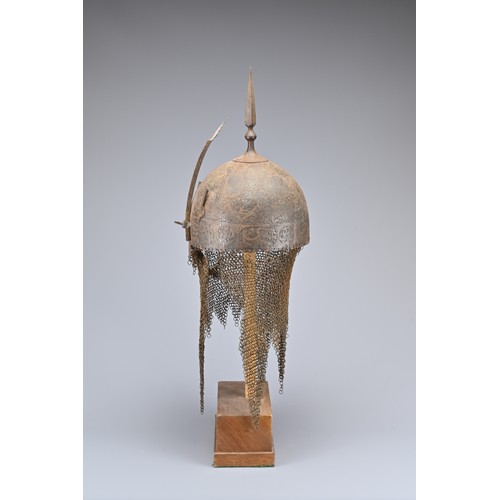 A PERSIAN KULAH KHUD METAL HELMET. With tall central spike and ...