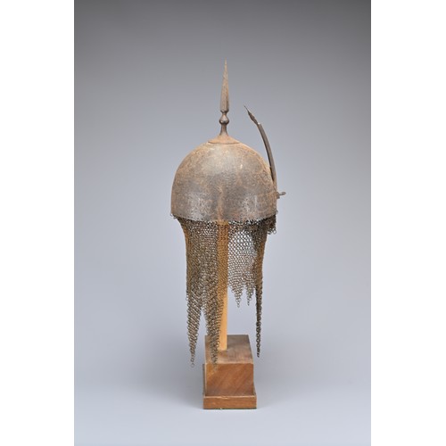 A PERSIAN KULAH KHUD METAL HELMET. With tall central spike and ...