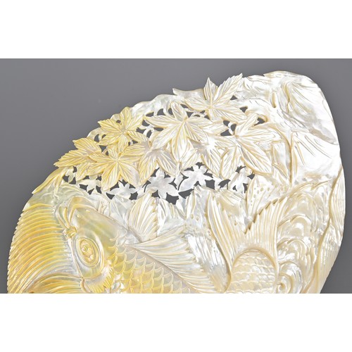 A LARGE CARVED MOTHER OF PEARL SHELL, PROBABLY JAPANESE EARLY 20TH ...