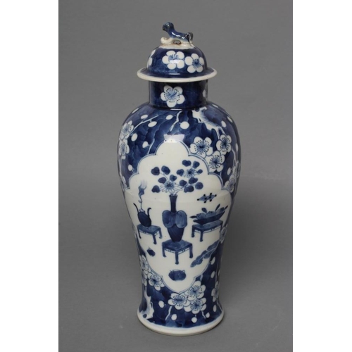 A CHINESE PORCELAIN VASE AND COVER of slender inverted baluster form ...