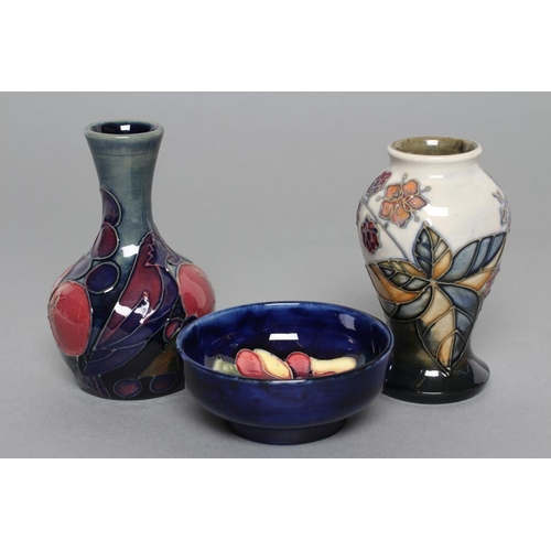 TWO MOORCROFT POTTERY SMALL VASES, 20th century, comprising a Bramble ...