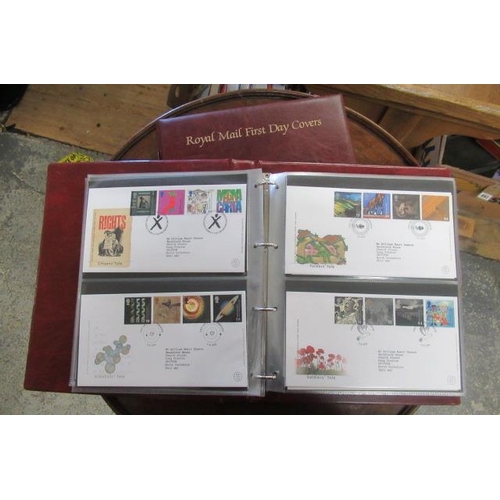 TWO ALBUMS OF FIRST DAY COVERS INCLUDING TEN POUND STAMP