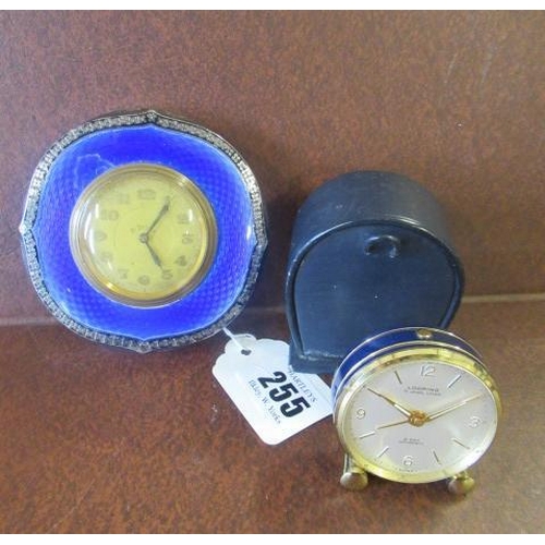 SILVER AND ENAMEL DRESSING TABLE CLOCK AND A LOOPING TRAVEL ALARM CLOCK