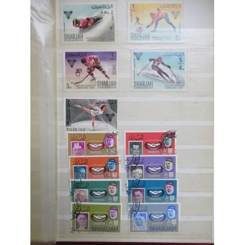 FOUR ALBUMS OF WORLD STAMPS INCLUDING MIDDLE EASTERN EXAMPLES