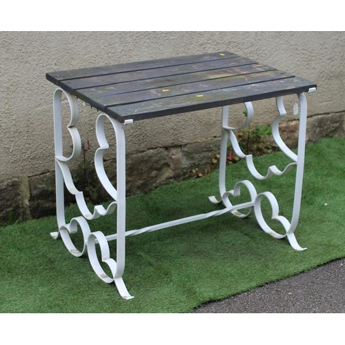 A CAST IRON TABLE of oblong form with slatted wood top, on open ...