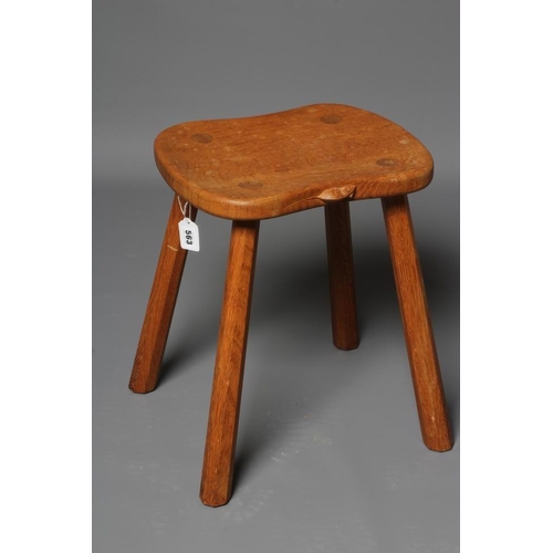 A ROBERT THOMPSON ADZED OAK STOOL of waisted rounded oblong seat raised ...